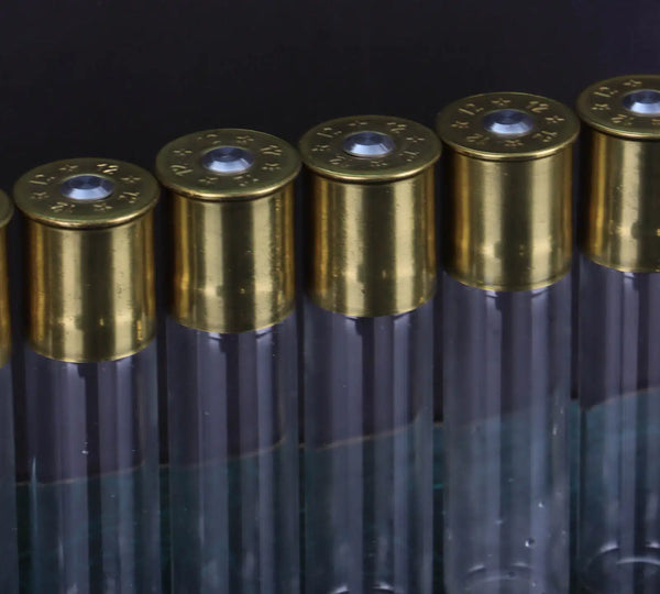 A Set of Nine Shotgun Shell Design Brass-Mounted Glass Travel Miniatur ...