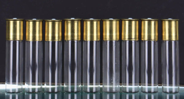 A Set of Nine Shotgun Shell Design Brass-Mounted Glass Travel Miniatur ...